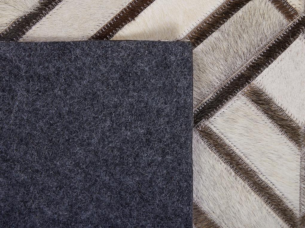 Béžový kožený koberec  160 x 230 cm TEKIR Beliani