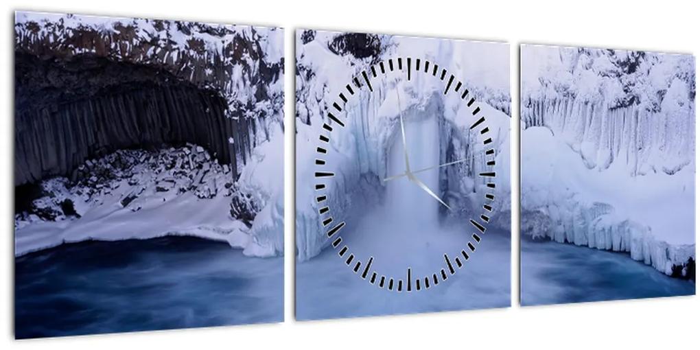 Obraz vodopádu v zimě (s hodinami) (90x30 cm)