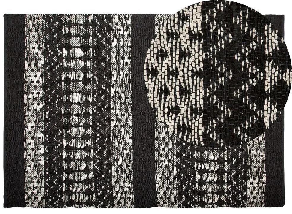 Kožený koberec 140 x 200 cm černý/béžový SOKUN Beliani