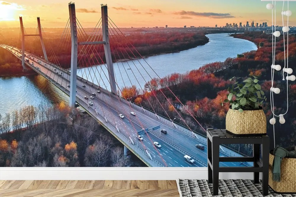 Fototapeta Beautiful Panoramic Aerial Drone View To Cable-Stayed Siekierkowski Bridge Over The Vistula River And Warsaw City Skyscrapers, Poland In Gold Red Autumn Colors In November Evening At Sunset Hladký vinyl 152.5x104