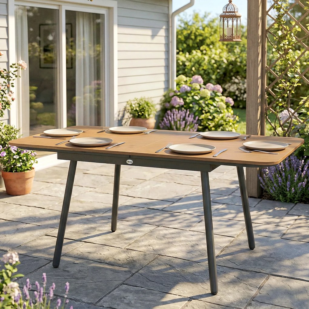 Outsunny Zahradní stůl 140 x 80 cm pro 6 osob odolný proti korozi Venkovní jídelní stůl s WPC deskou Nastavitelné nohy, teakové dřevo