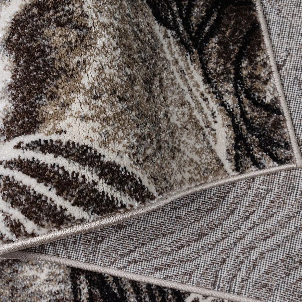 Moderní koberec hnědé barvy s abstraktním motivem Šířka: 120 cm | Délka: 170 cm