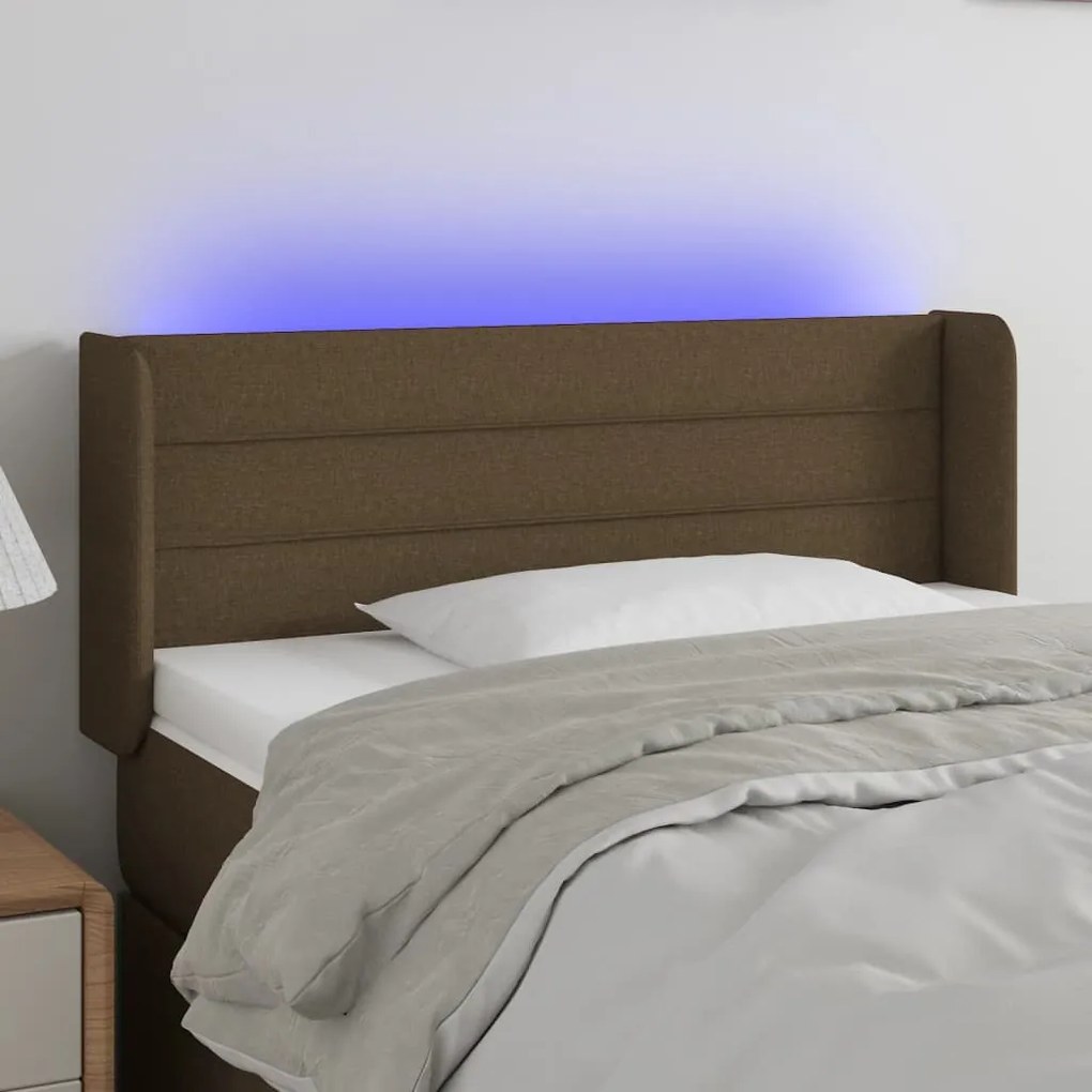 Čelo postele s LED tmavě hnědé 83 x 16 x 78/88 cm textil 3123353