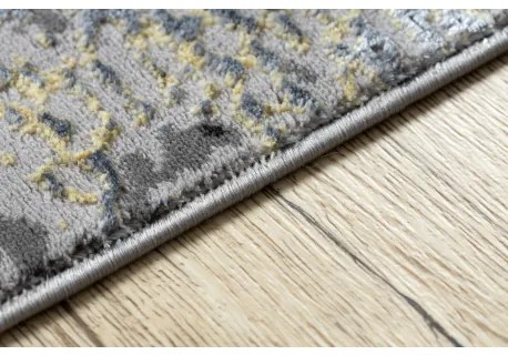 Moderní koberec DE LUXE 633 Abstrakce Strukturální krém / zlato velikost 240x340 cm | krásné koberce cz