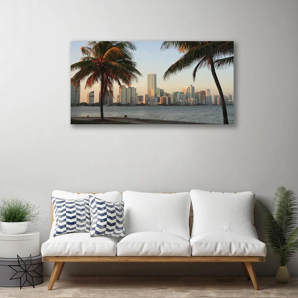 Obraz na plátně Palmy Tropy Město Moře 125x50 cm