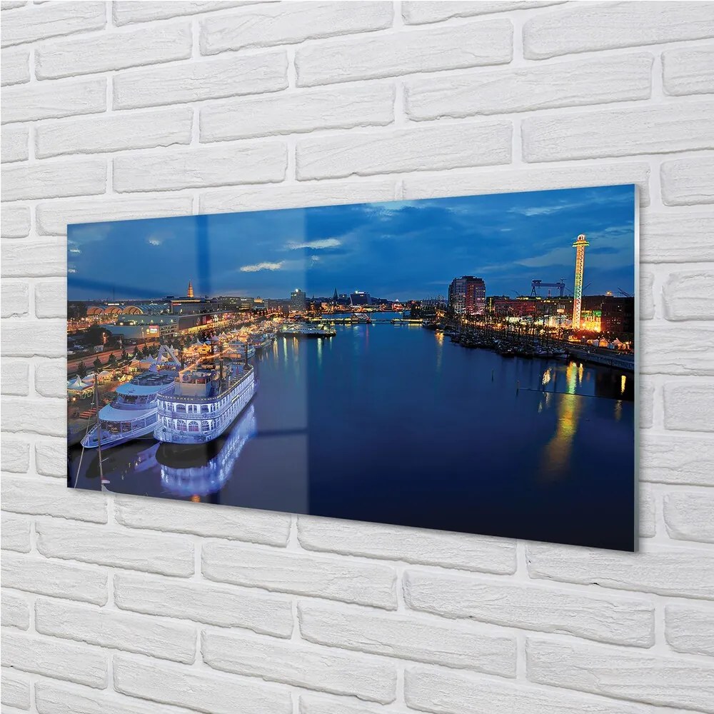 Obraz na skle Loď moře město na noční obloze 120x60 cm