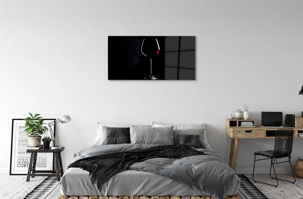 Obraz na skle Černé pozadí se sklenkou vína 100x50 cm