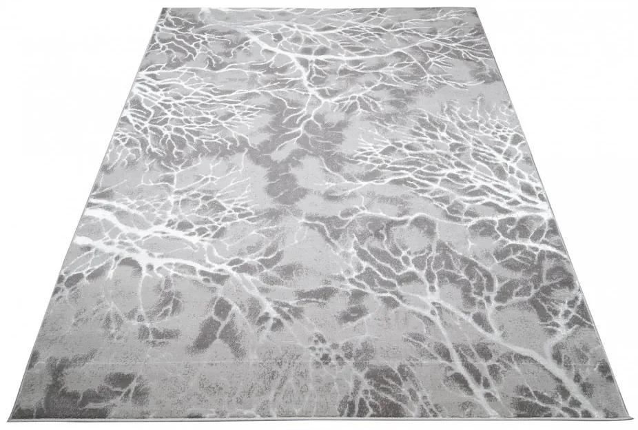 Jednoduchý moderní koberec v šedé barvě s bílým motivem Šířka: 140 cm | Délka: 200 cm