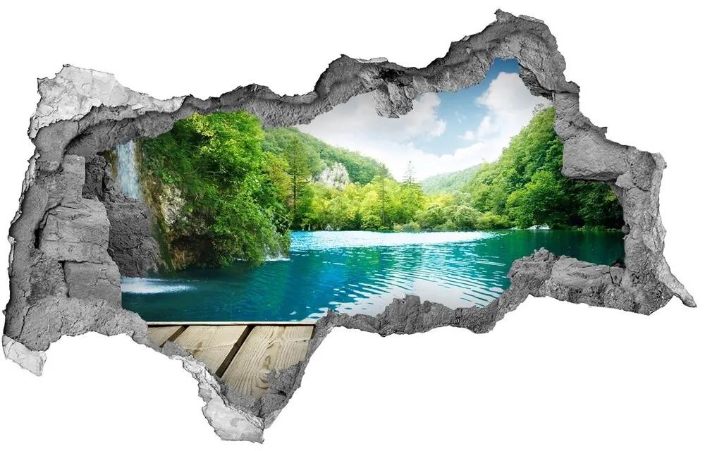 Wallmuralia Díra 3D ve zdi nálepka Vodopád v lese 95x73 cm