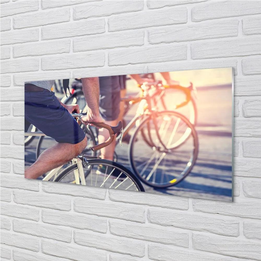 Obraz na skle cyklisté lidí 100x50 cm