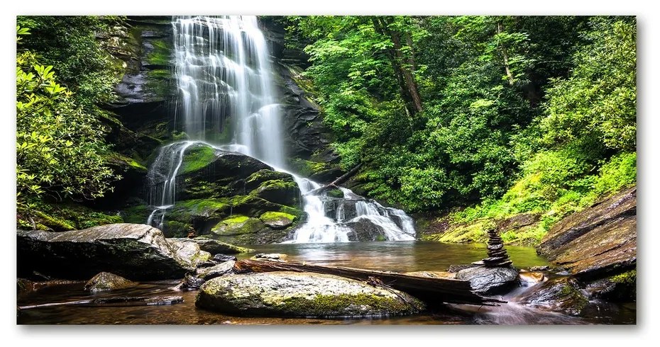 Wallmuralia Foto obraz skleněný horizontální Vodopád v lese 100x50 cm