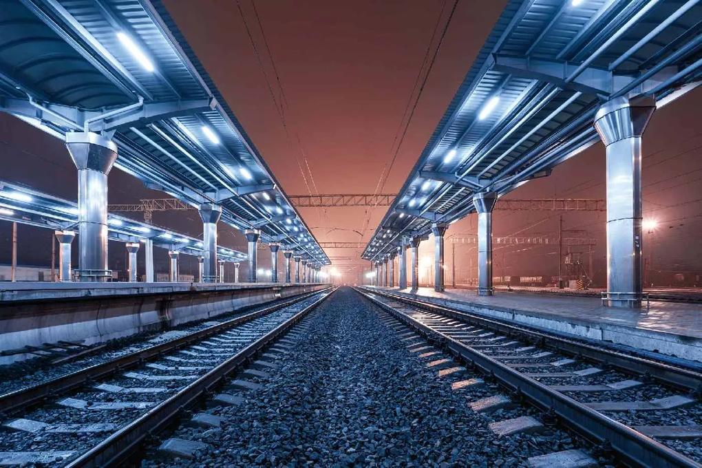 DIMEX | Samolepicí vliesová fototapeta na zeď Vlakové nádraží v noci MA-5-2862 | 375 x 250 cm | žlutá, metalická, šedá