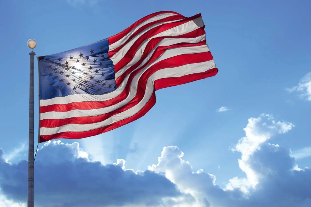 DIMEX | Samolepicí vliesová fototapeta na zeď Americká vlajka ve větru MA-5-1497 | 375 x 250 cm | modrá, červená, bílá