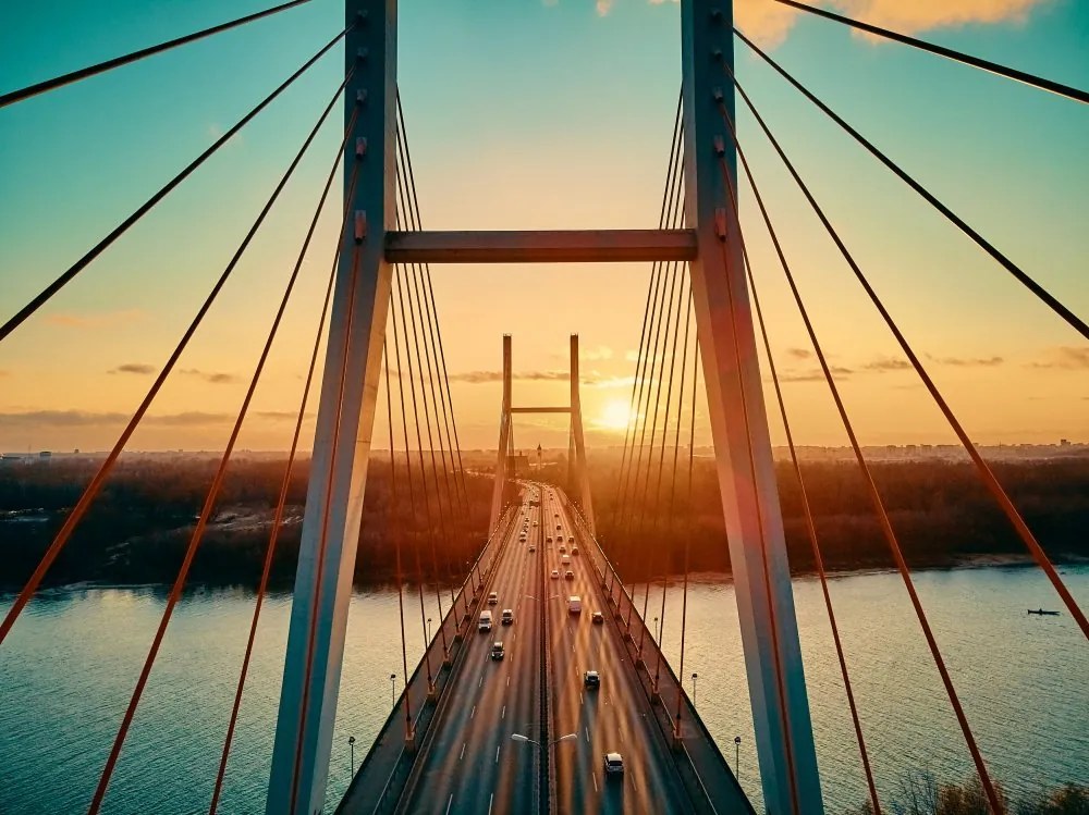 Fototapeta Beautiful Panoramic Aerial Drone View To Cable-Stayed Siekierkowski Bridge Over The Vistula River And Warsaw City Skyscrapers, Poland In Gold Red Autumn Colors In November Evening At Sunset Omyvatelný vlies 368x254