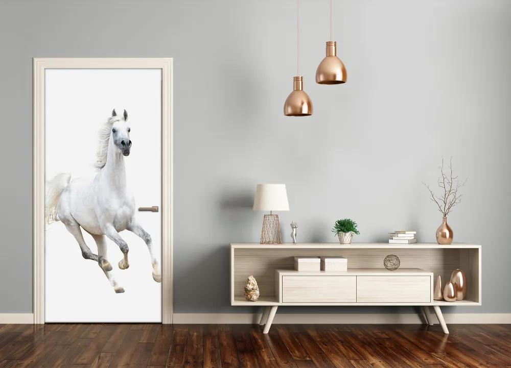 Samolepící fototapeta na dveře Bílý kůň ve cvalu 95x205 cm