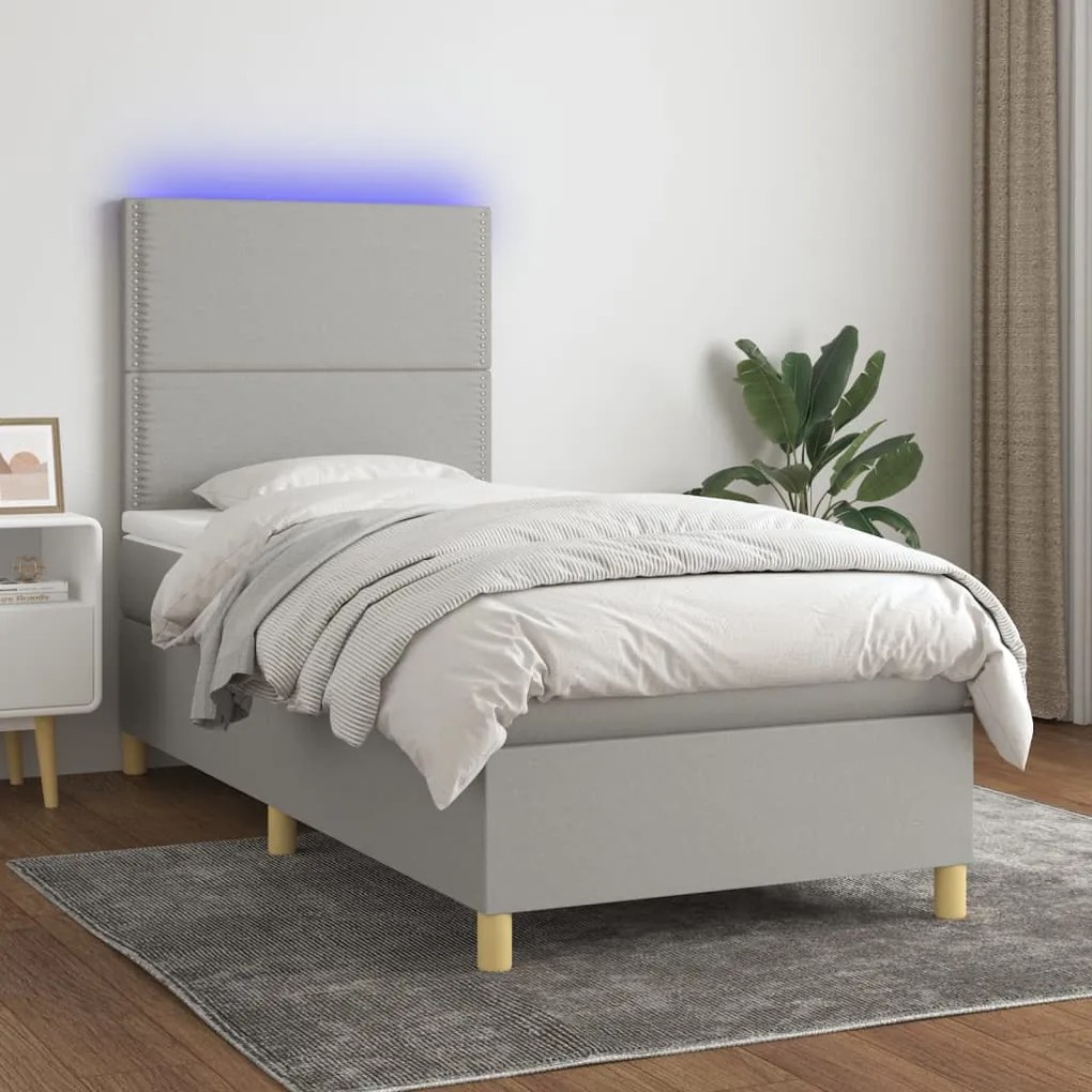 Box spring postel s matrací a LED světle šedá 90x200 cm textil