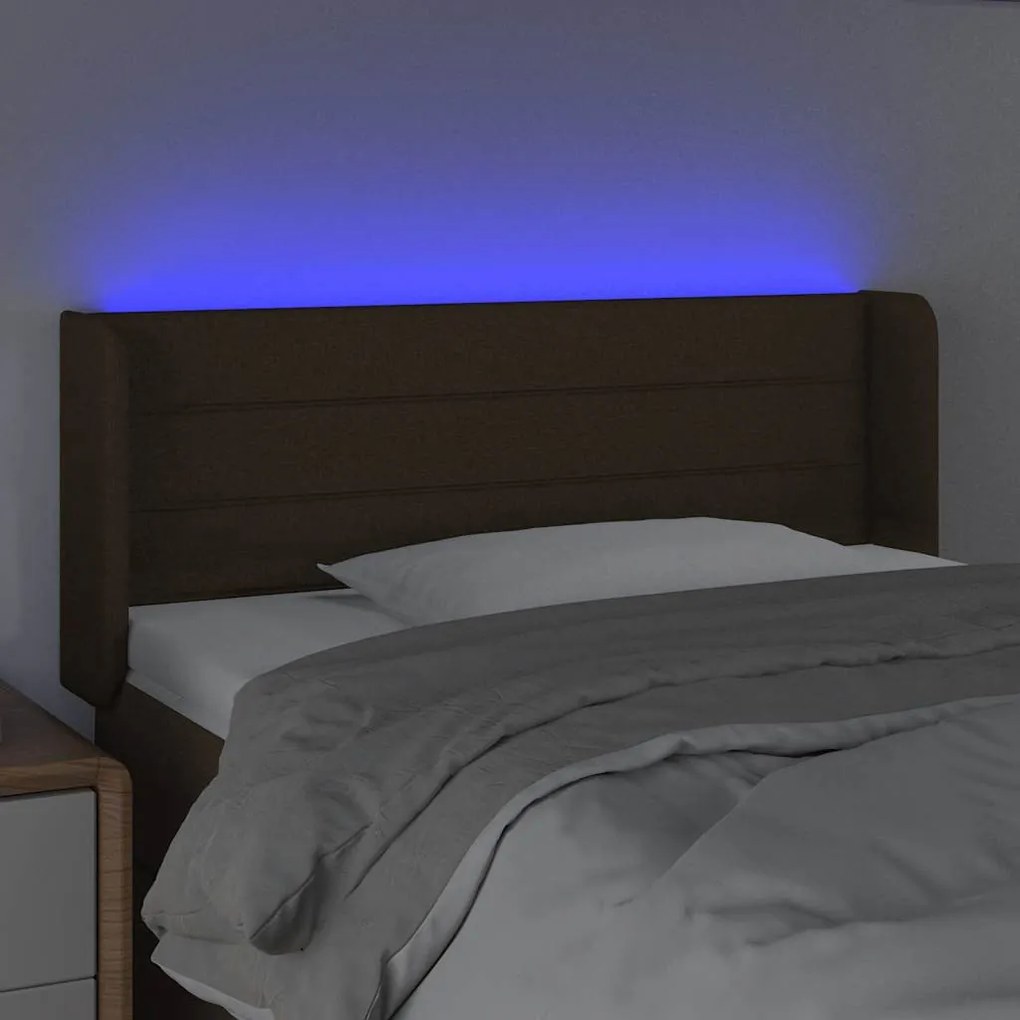 Čelo postele s LED tmavě hnědé 83 x 16 x 78/88 cm textil 3123353