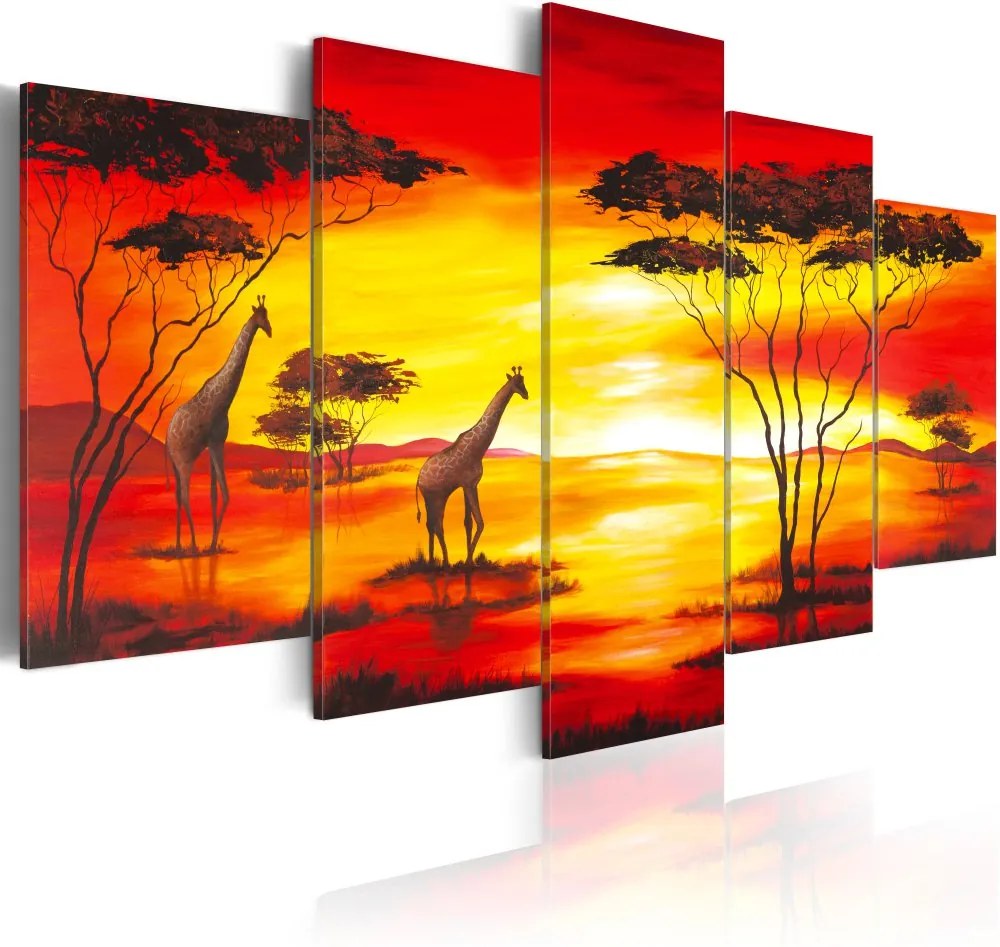 Obraz na plátně Bimago - Giraffes on the background with sunset 100x50 cm