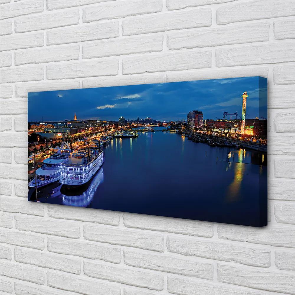 Obrazy na plátně Loď moře město na noční obloze 125x50 cm