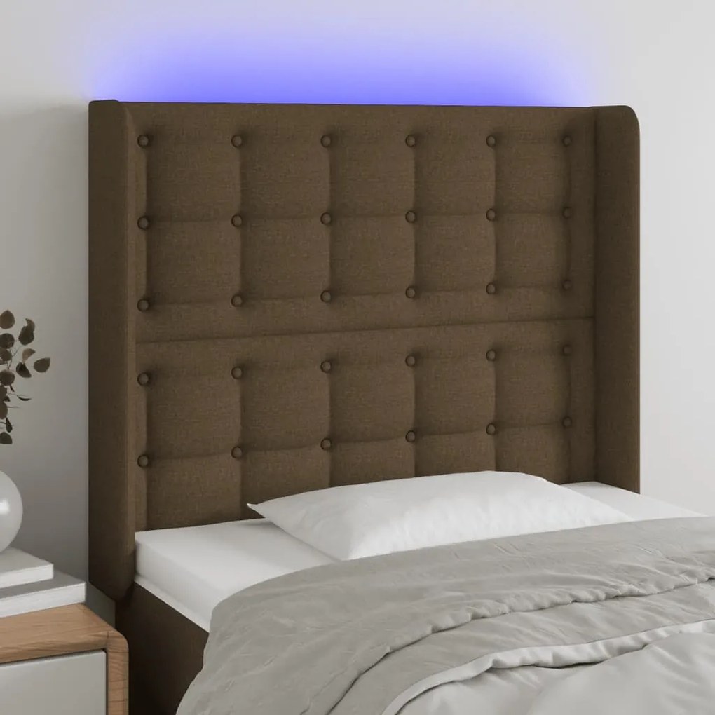 Čelo postele s LED tmavě hnědé 83 x 16 x 118/128 cm textil 3124459