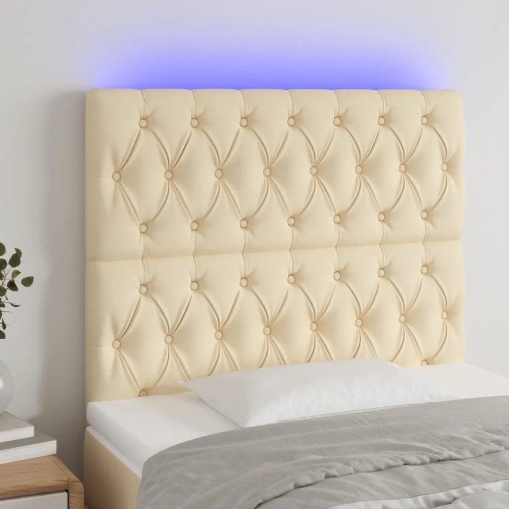 Čelo postele s LED krémová 100x7x118/128 cm textil