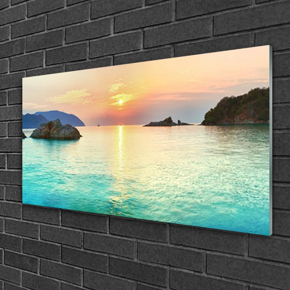 Obraz na skle Slunce Skály Moře Krajina 140x70 cm