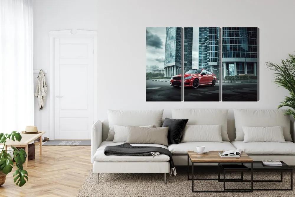 Vícedílný obraz Červené Auto Na Pozadí Moderních Mrakodrapů Nedostatek Nedostatek Přírodní plátno 60x40