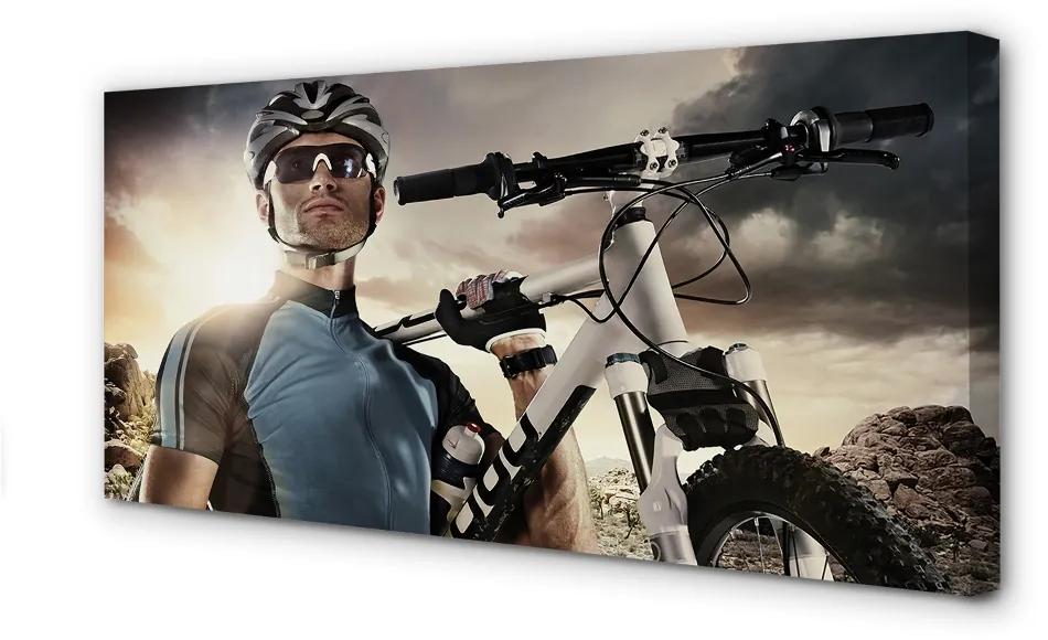 Obrazy na plátně Cyklista na kole mraky 100x50 cm