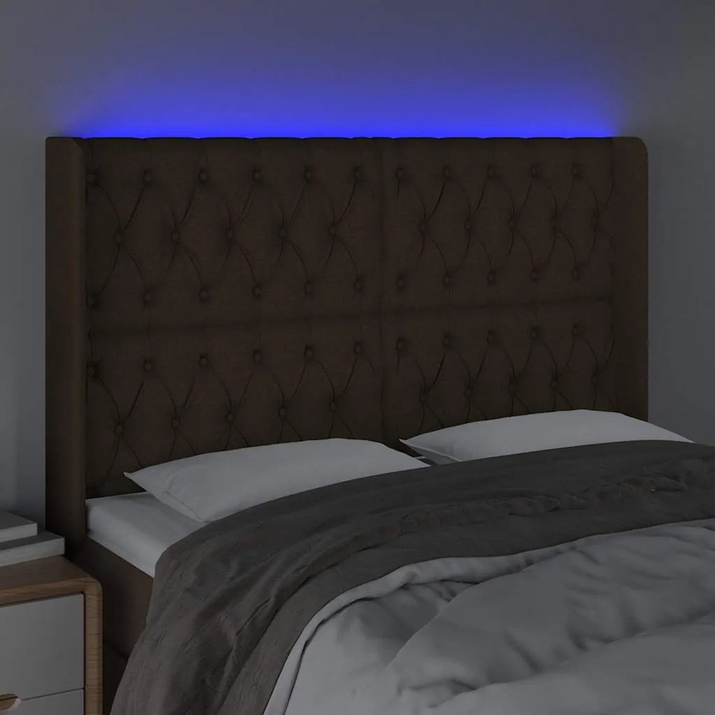 Čelo postele s LED tmavě hnědé 147 x 16 x 118/128 cm textil 3124385