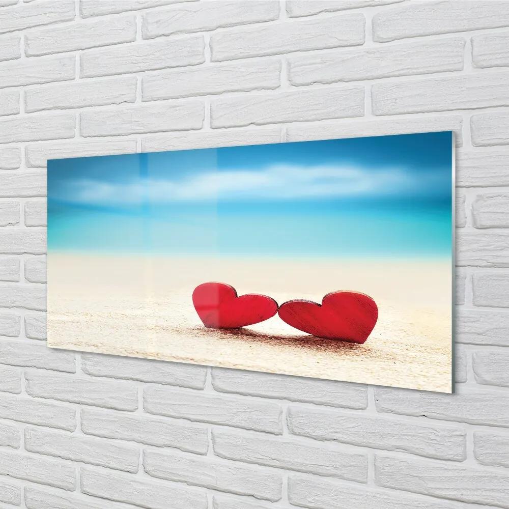 Obraz na skle Srdce červené písečné moře 100x50 cm