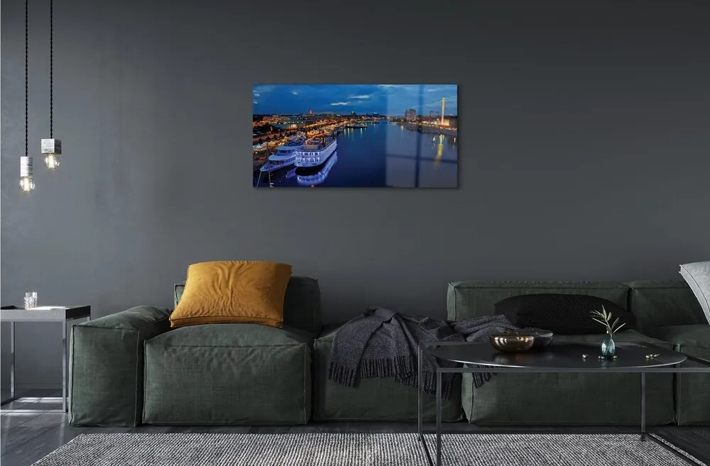 Obraz na skle Loď moře město na noční obloze 100x50 cm