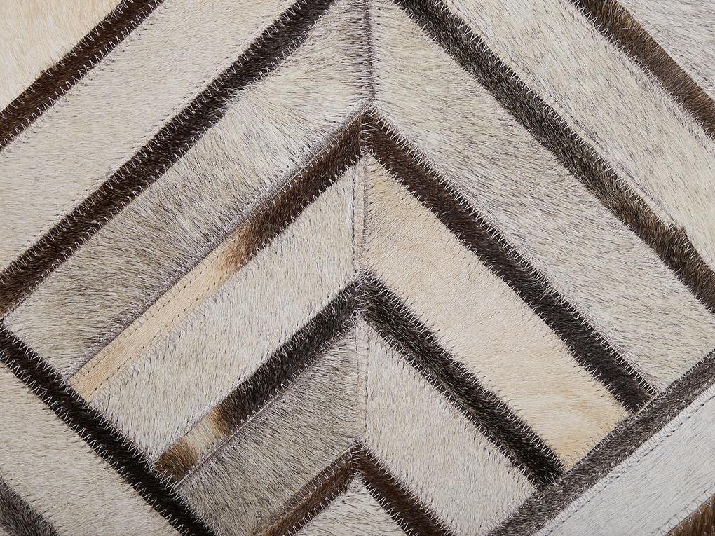 Béžový kožený koberec  140 x 200 cm TEKIR Beliani