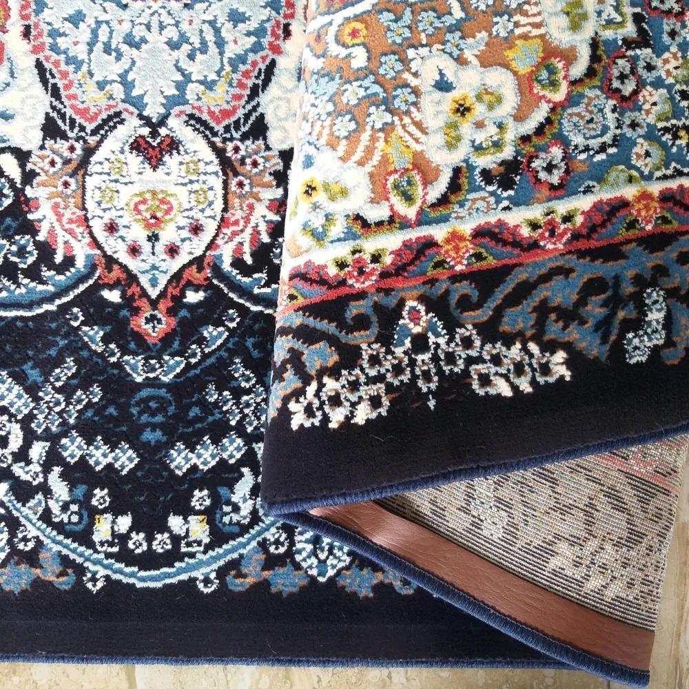 Modrý vzorovaný vintage koberec s třásněmi Šířka: 150 cm | Délka: 230 cm