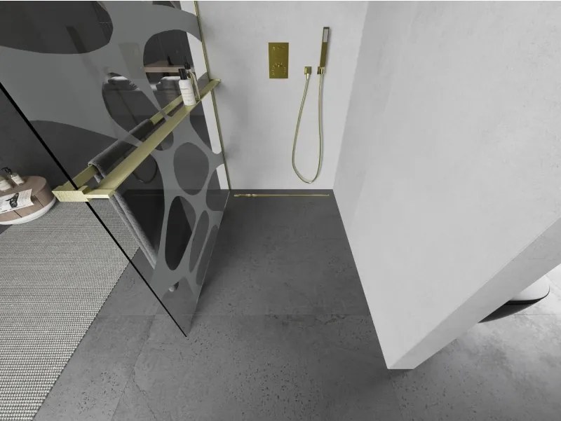Mexen Kioto+ L, sprchová zástěna Walk-In s poličkou a věšákem 110 x 200 cm, 8mm čiré sklo bílý vzor, ​​zlatý matný profil, 800-110-123-55-97