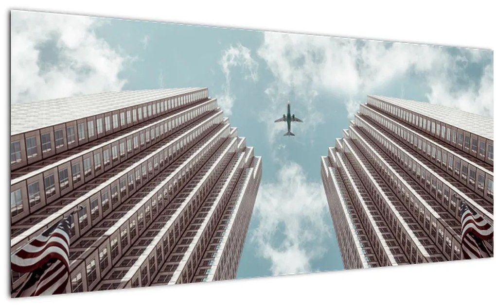 Obraz letadla mezi budovami (100x40 cm), 40 dalších rozměrů