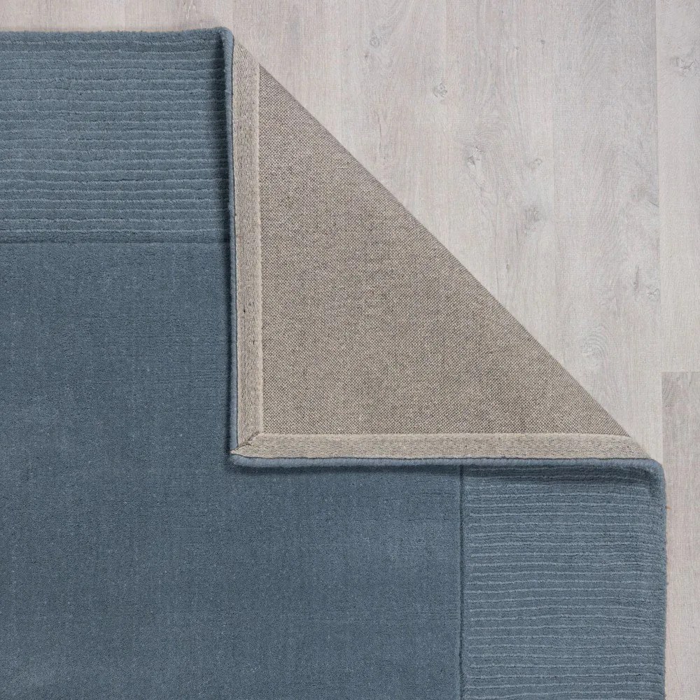 Tmavě modrý ručně tkaný vlněný koberec 200x290 cm Textured Wool Border – Flair Rugs