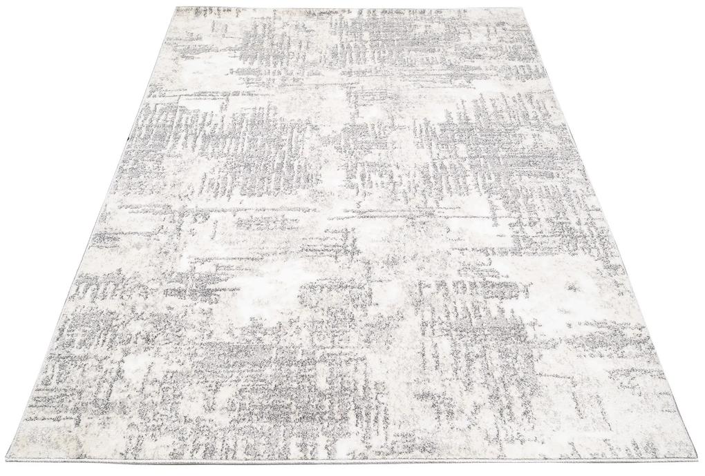 Krémový designový koberec se světle šedým vzorem