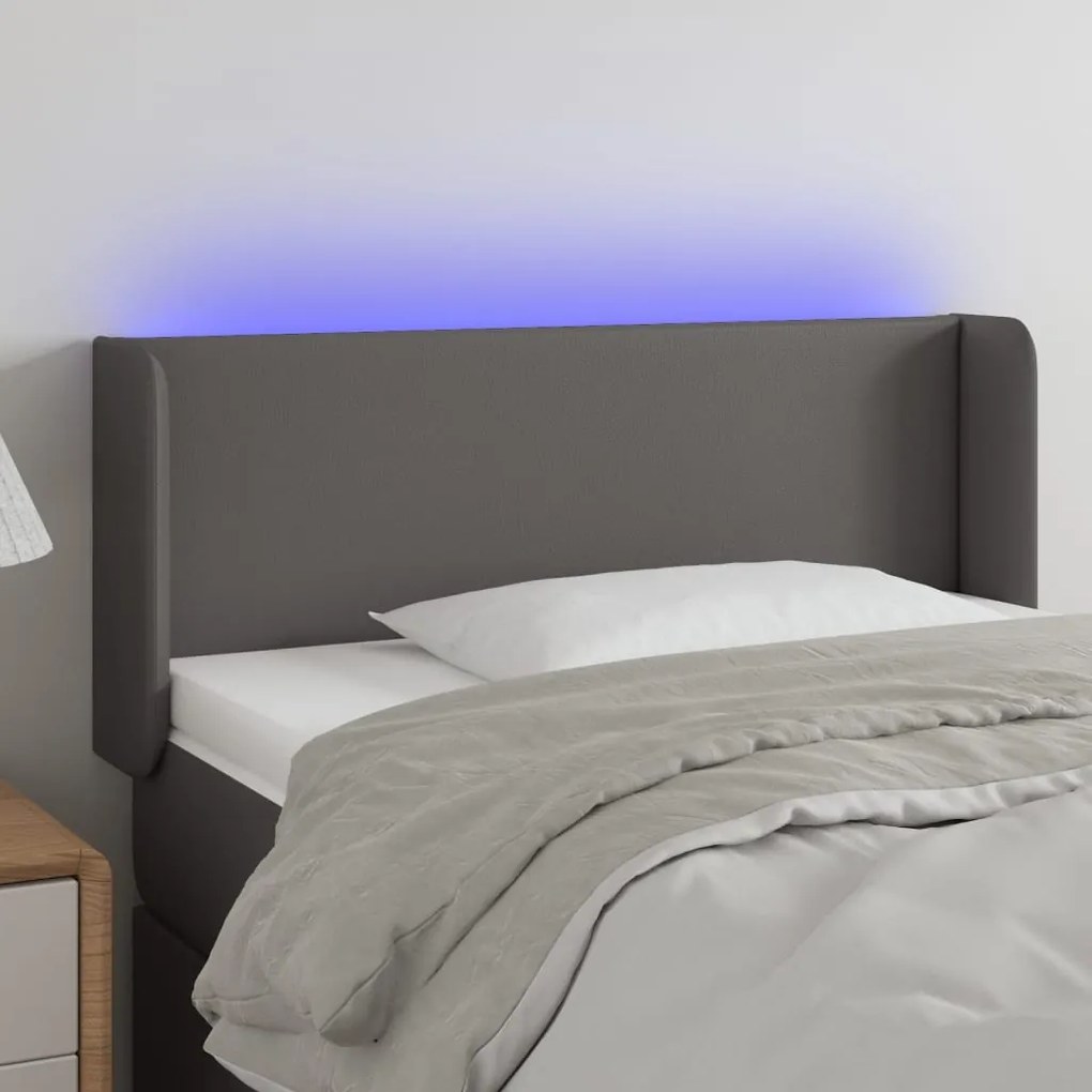 Čelo postele s LED šedé 83 x 16 x 78/88 cm umělá kůže