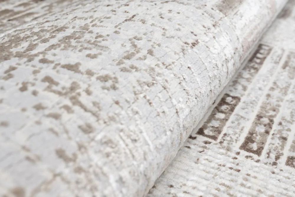 Designový vintage koberec s geometrickými vzory v hnědých odstínech Šířka: 80 cm | Délka: 150 cm