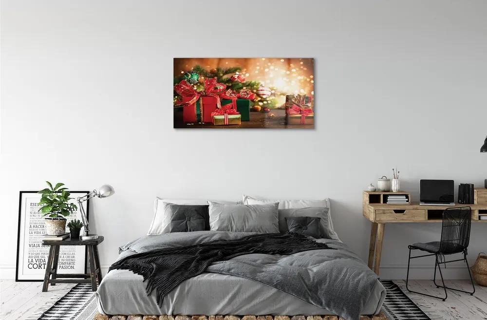 Obraz na skle Dárky vánoční ozdoby světla 100x50 cm