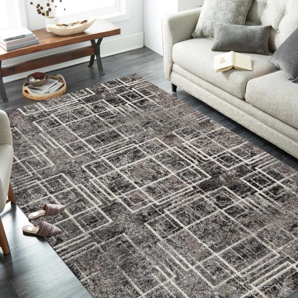 Moderní koberec šedé barvy s abstraktním motivem Šířka: 120 cm | Délka: 170 cm