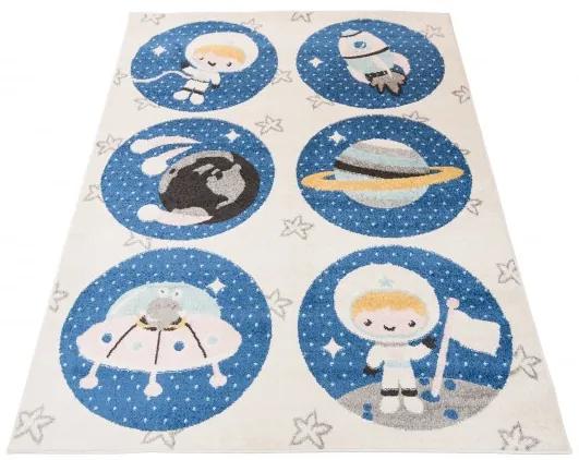 Dětský kusový koberec HAPPY H330A Kosmonaut Raketa Vesmír bílý / modrý Rozměr: 120x170 cm