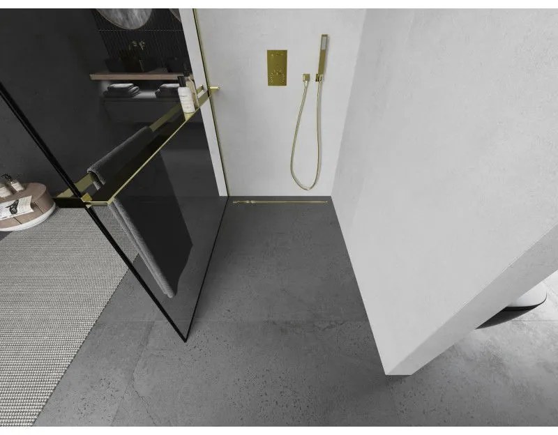 Mexen Kioto+ L, sprchová zástěna Walk-In s poličkou a věšákem 110 x 200 cm, 8mm čiré sklo černý vzor, zlatý lesklý profil, 800-110-123-50-70