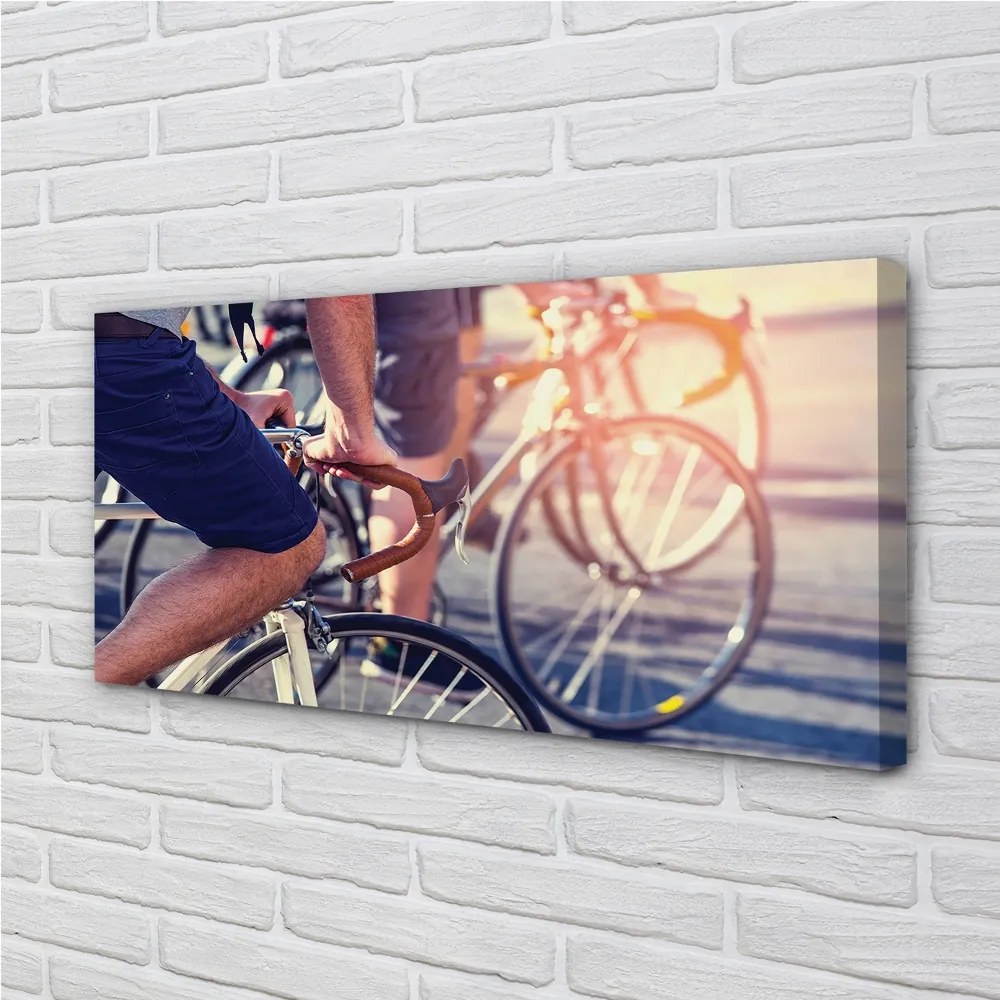 Obrazy na plátně cyklisté lidí 100x50 cm