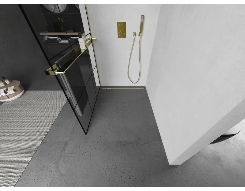 Mexen Kioto+ L, sprchová zástěna Walk-In s poličkou a věšákem 100 x 200 cm, 8mm čiré sklo černý vzor, zlatý lesklý profil, 800-100-123-50-77