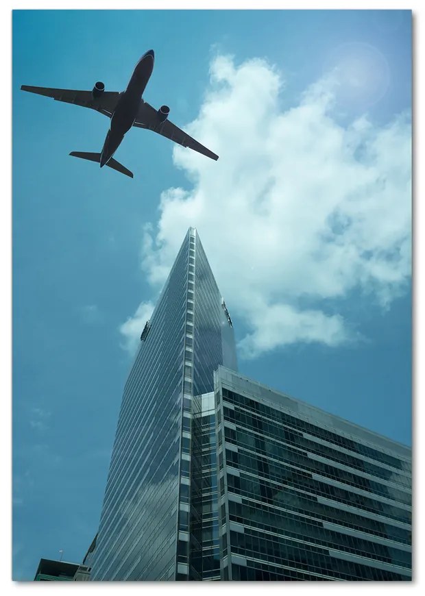 Wallmuralia Fotoobraz na skle Letadlo nad městem 70x100 cm