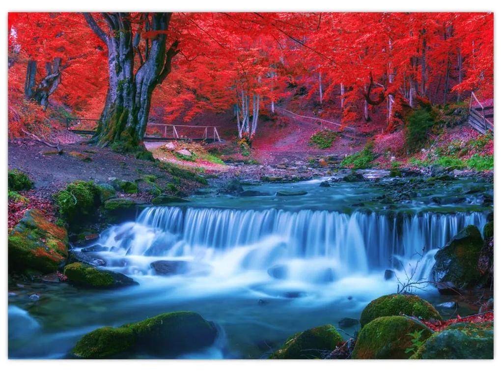 Skleněný obraz vodopádu v červeném lese (70x50 cm)