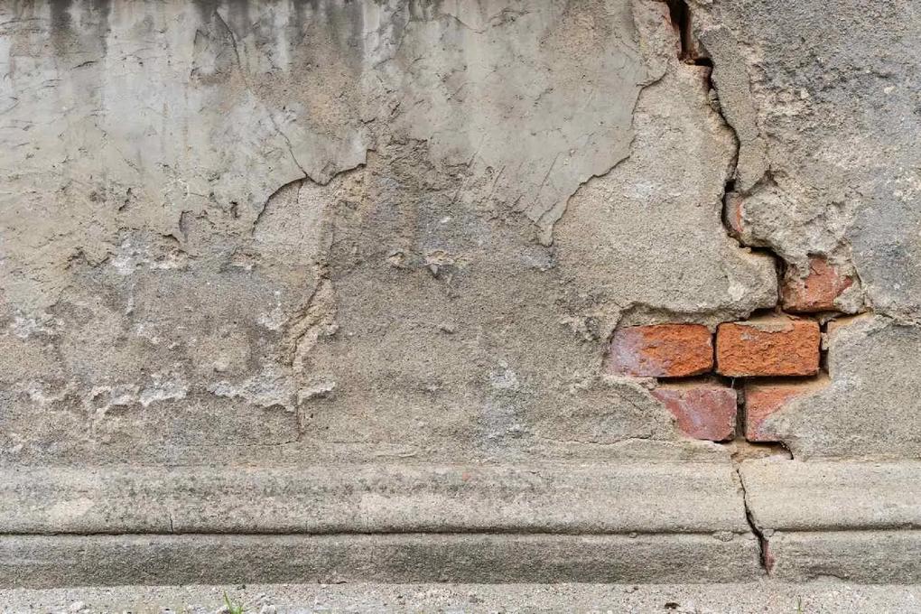 DIMEX | Samolepicí vliesová fototapeta na zeď Detail rozpadající se zdi MA-5-2678 | 375 x 250 cm | oranžová, šedá