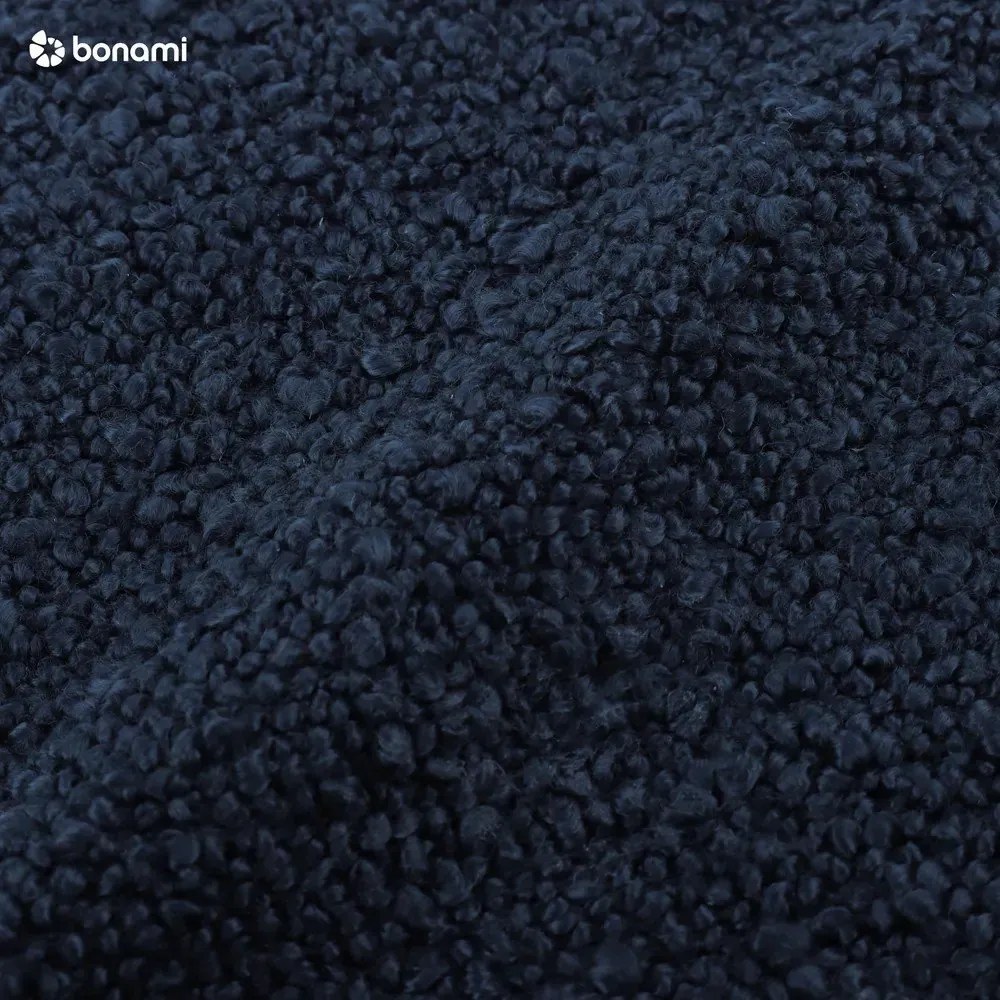 Tmavě modré křeslo z textilie bouclé Molino – Micadoni Home