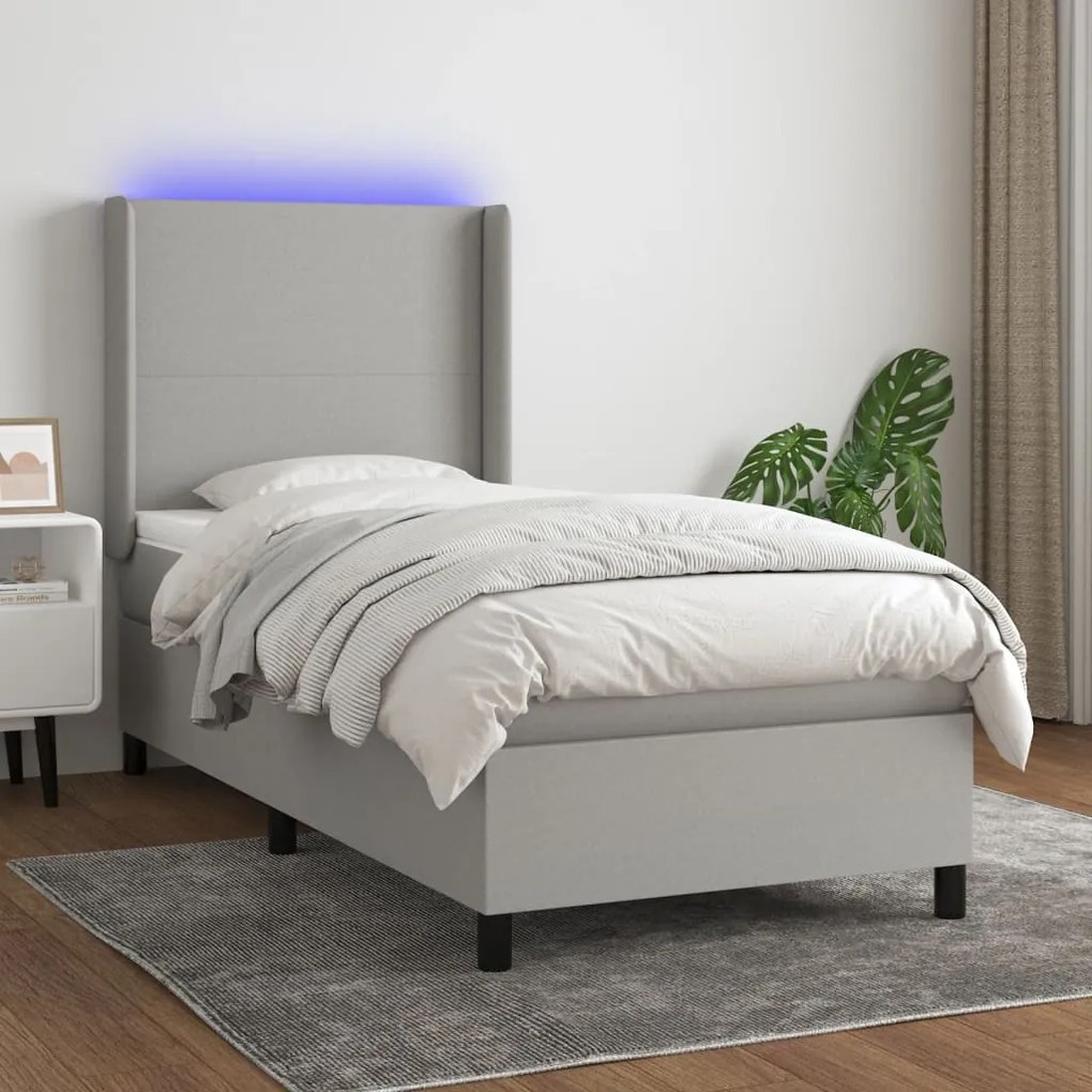 Box spring postel s matrací a LED světle šedá 90x200 cm textil